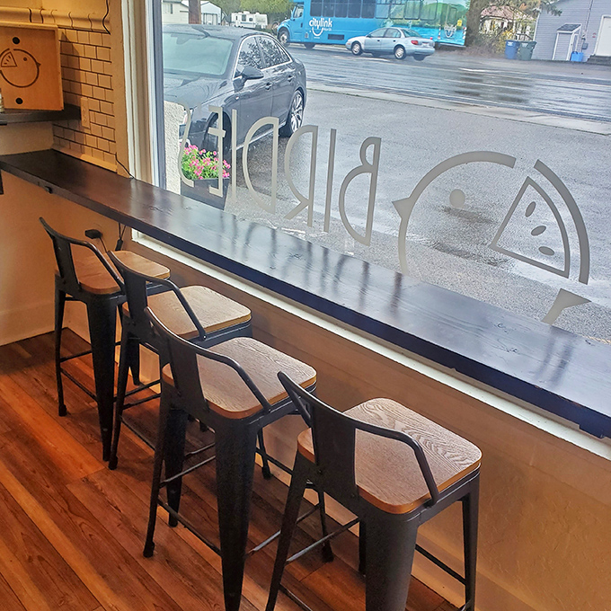 Window-side seating offers prime people-watching with your pie. The Birdie's logo reversed on glass reminds passersby of what they're missing.