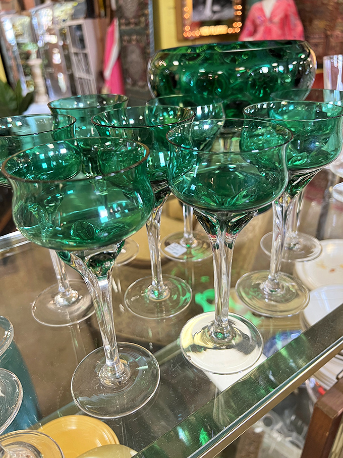 Emerald green vintage glassware catches light like liquid jewels, making every sip feel fancy even if it's just water.