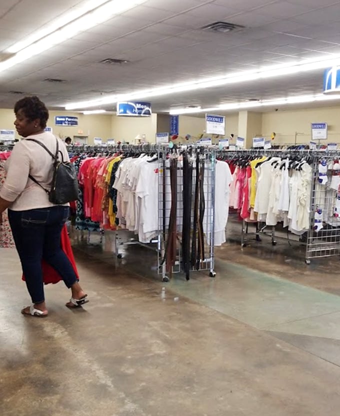 Treasure hunters navigate the aisles with practiced precision, their shopping carts like metal detectors scanning for that perfect hidden gem.