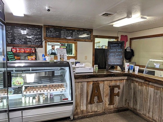 Order at this rustic counter where chalkboard menus and display cases promise delicious decisions ahead for hungry travelers.