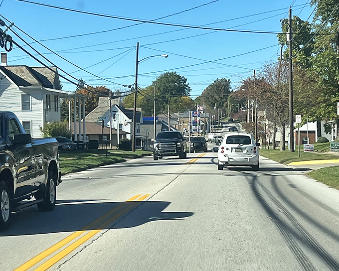 Apple Creek's main street showcases its small-town character. Utility poles and modest buildings speak to its practical, unfussy nature.