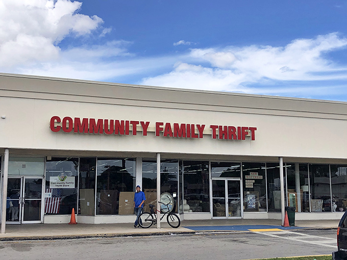 Community Family Thrift's bold red letters stand out against the sky &ndash; a landmark for locals seeking affordable essentials.