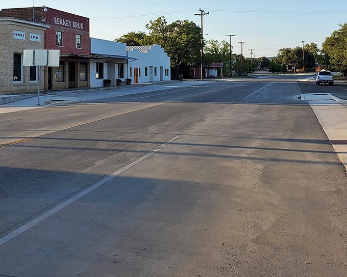 Wide empty streets and vintage storefronts create a peaceful scene where rush hour never really happens at all.