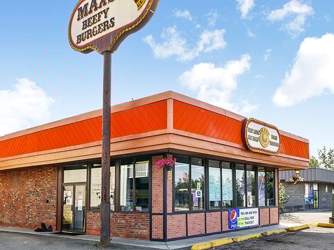 That bright orange roof is like a burger lighthouse, guiding hungry souls to a safe harbor of deliciousness.