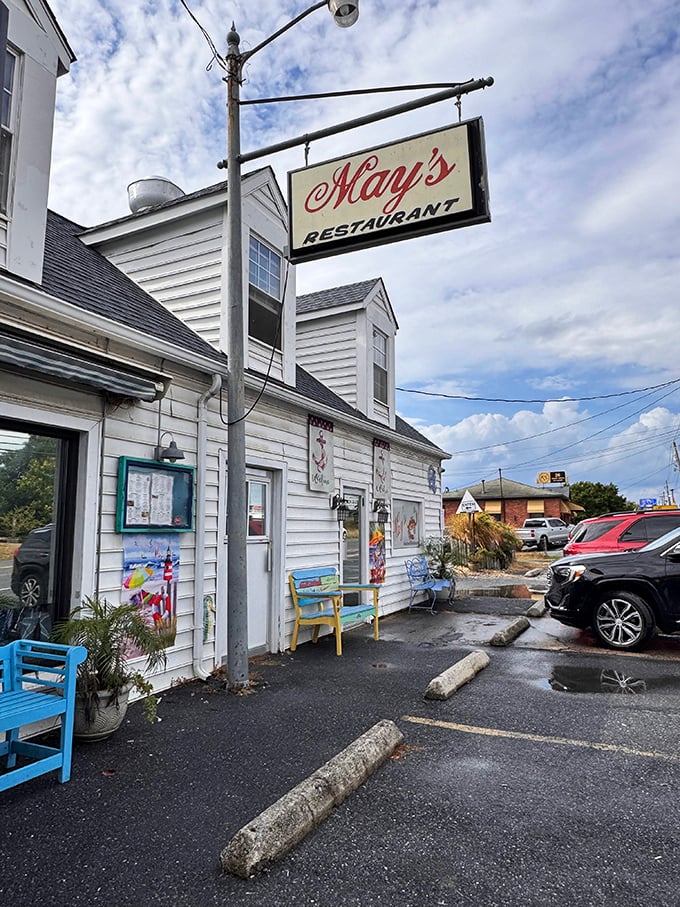 May's charming white exterior and vintage sign whisper of seafood traditions passed down through generations. A Frederick classic!