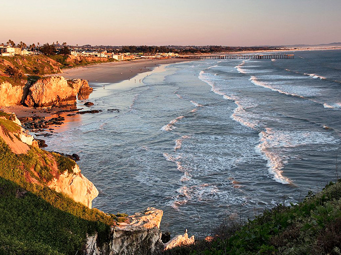 Pismo Beach's pier stretches into golden hour light, offering front-row seats to nature's nightly spectacular performance show.