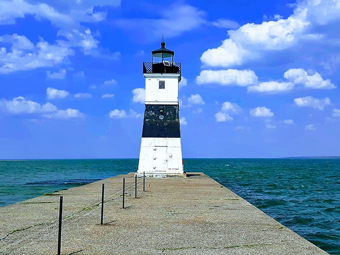 Presque Isle's lighthouse stands sentinel over Lake Erie. A postcard-perfect scene that's been guiding ships since 1872.