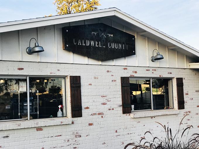 The clean white brick exterior of Caldwell County BBQ hides the gloriously messy, sauce-worthy treasures inside.