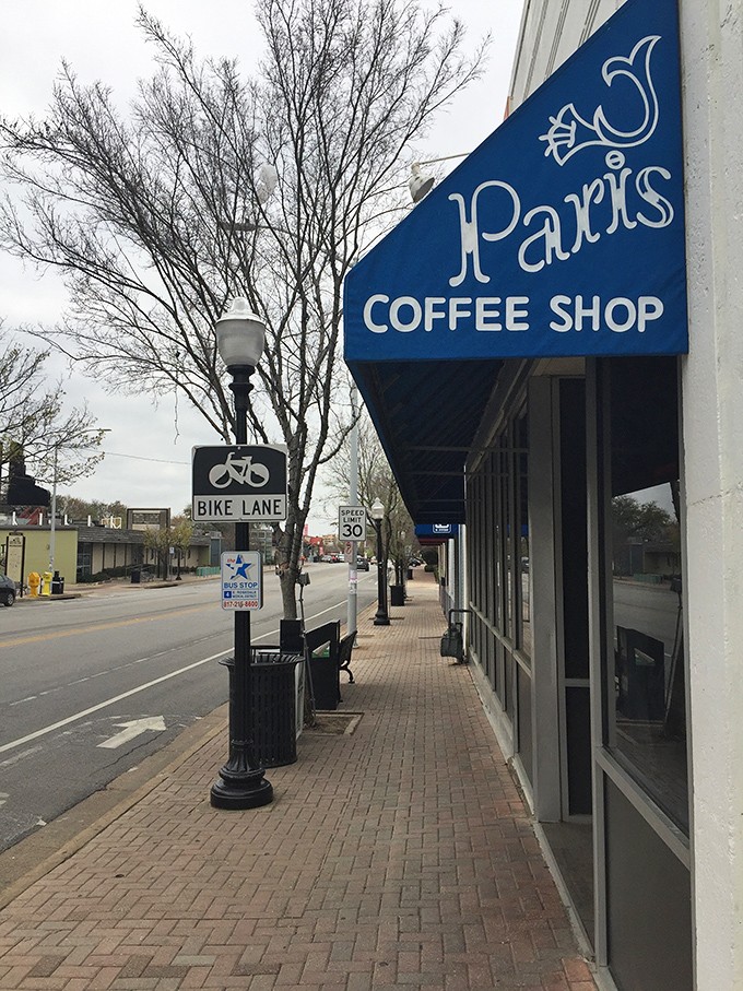 Winter or summer, Paris Coffee Shop's iconic blue sign promises the same warm welcome inside.