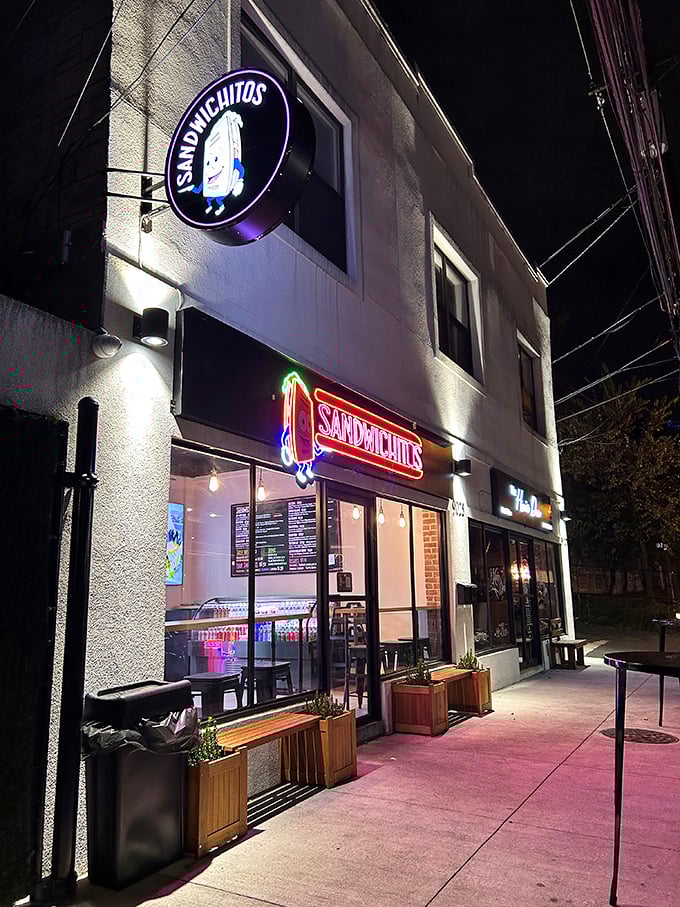 By night, Sandwichitos' neon glow transforms into a beacon for the sandwich-obsessed. Urban cool meets comfort food.