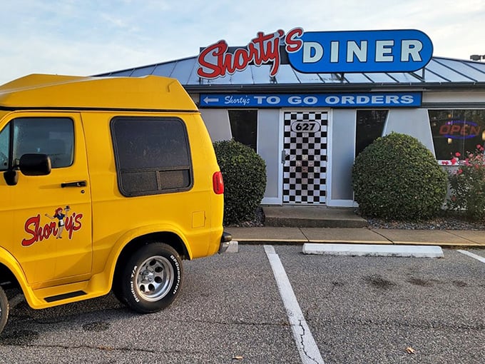 That vintage yellow van adds automotive charm to your morning meal adventure today.