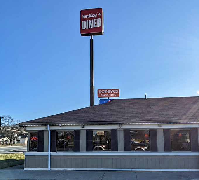 Like a cardinal in winter, Smiley's Diner's vibrant roof stands out in the landscape, signaling delicious refuge for hungry travelers.