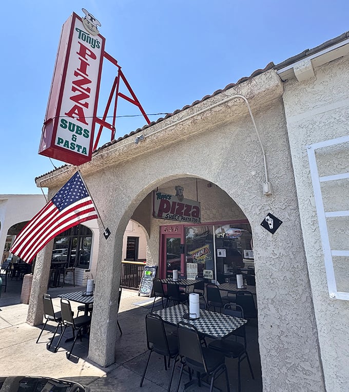 Tony's classic sign and American flag tell you this is pizza with deep community roots.