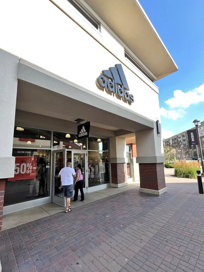 Adidas welcomes shoppers with a clean, minimalist storefront and maximum savings. Those three stripes might as well be dollar signs.