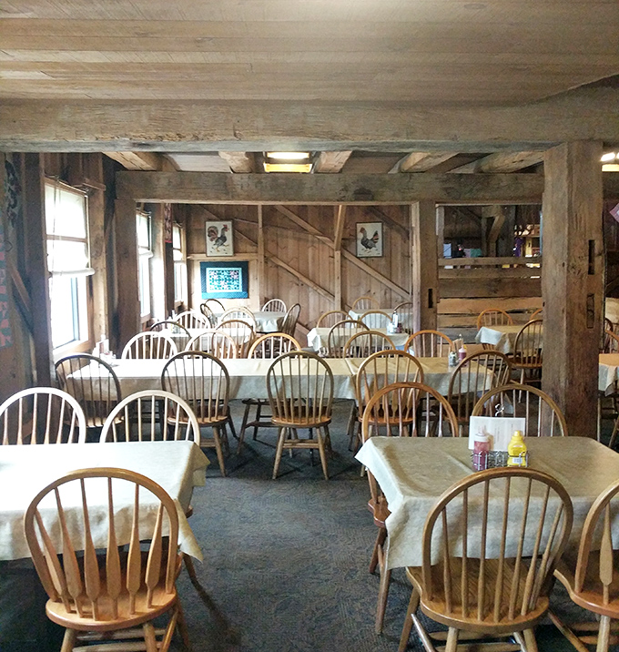 Windsor chairs and white tablecloths create a dining room that's country-elegant without a hint of pretension. Comfort awaits at every table.