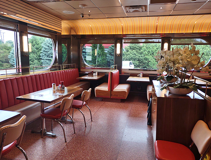 Red vinyl booths and panoramic windows create the quintessential diner experience—part transportation, part time machine, all comfort and conversation.