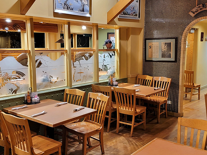 Etched glass dividers and warm wood create intimate dining spaces where you can pretend the calories don't count if you can't see the other tables.