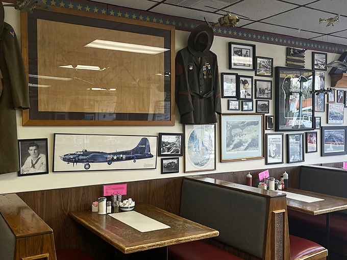 Military coats stand guard over diners, a reminder of Ypsilanti's proud manufacturing heritage that flavors every bite at The Bomber.