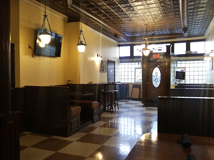 Pendant lights cast a warm glow over the checkered floor, creating that "where everybody knows your name" atmosphere Ohio does so well.