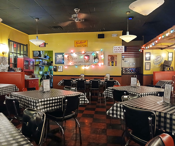 Yellow walls and red booths create the perfect backdrop for meals that become memories. The ceiling fans keep things cool while the food brings the heat.