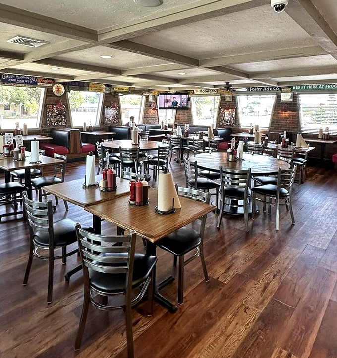 The dining room awaits the lunch rush, tables set with the essentials: napkins (you'll need them) and sauce bottles (you might not). 