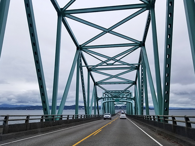 Crossing the Astoria-Megler Bridge feels like driving through a geometric dream, with the mighty Columbia River stretching to the horizon on both sides.