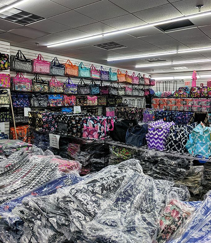 A wall of colorful bags that solves both your "how to carry all these purchases" and "what to get Aunt Linda" problems simultaneously.