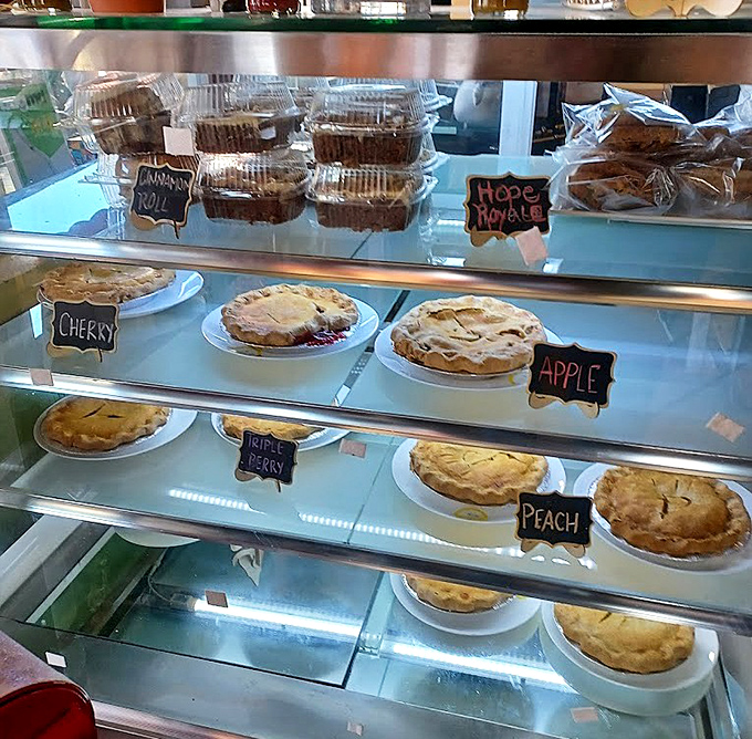 The pie case: where willpower goes to die and diet plans are forgotten faster than New Year's resolutions by February 1st.