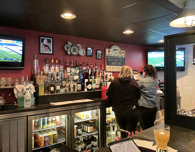 The bar at Restaurant 55 isn't just serving drinks; it's dispensing liquid courage to tackle that double-patty burger you've been eyeing.