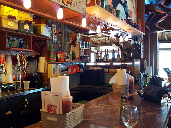 Behind the bar, organized chaos reigns &ndash; where beach-perfect cocktails are born amid fishing memorabilia and coastal kitsch.