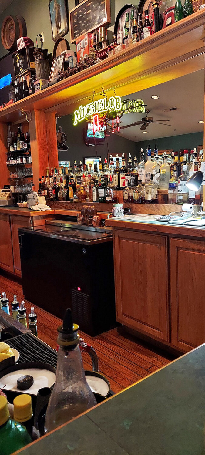 The bar doesn't just serve drinks&mdash;it tells stories through neon signs and decades of memorabilia. Listen closely.