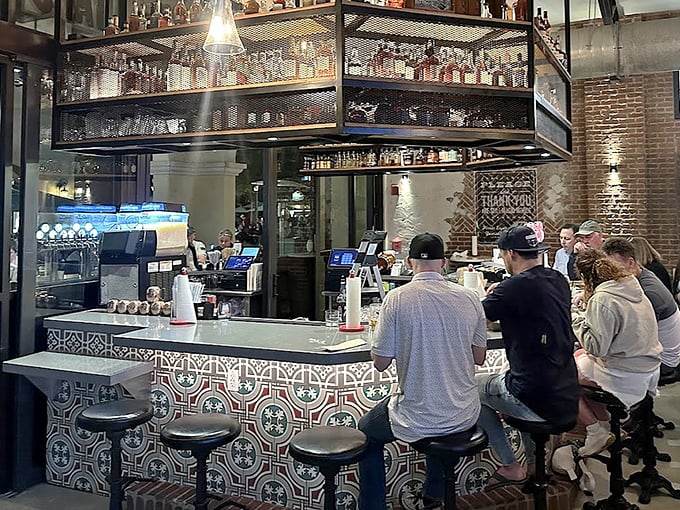 The bar showcases an impressive bourbon collection that would make a Kentucky colonel weep with joy. Liquid barbecue sauce, anyone?