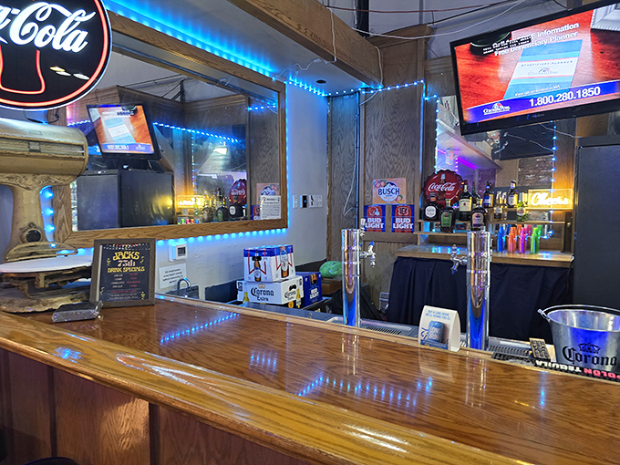 The bar area glows with blue lights and nostalgia, where regulars have been telling the same stories&mdash;with slight embellishments&mdash;for years.