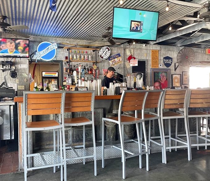 The bar – where seafood stories grow taller with each drink, and nobody minds because you're all in this delicious adventure together.