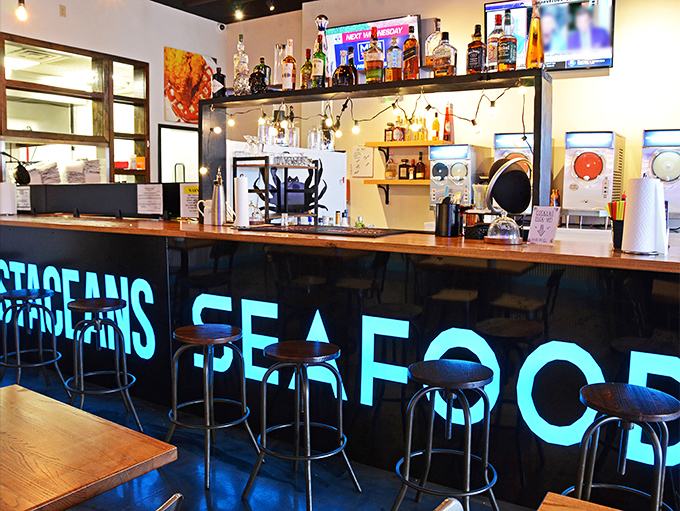 The bar glows blue like the depths of the ocean, promising libations that pair perfectly with creatures from the deep.