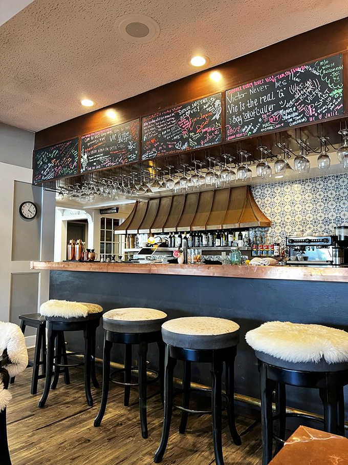 The bar's cozy stools topped with fuzzy cushions say "stay awhile" in the nicest possible way.