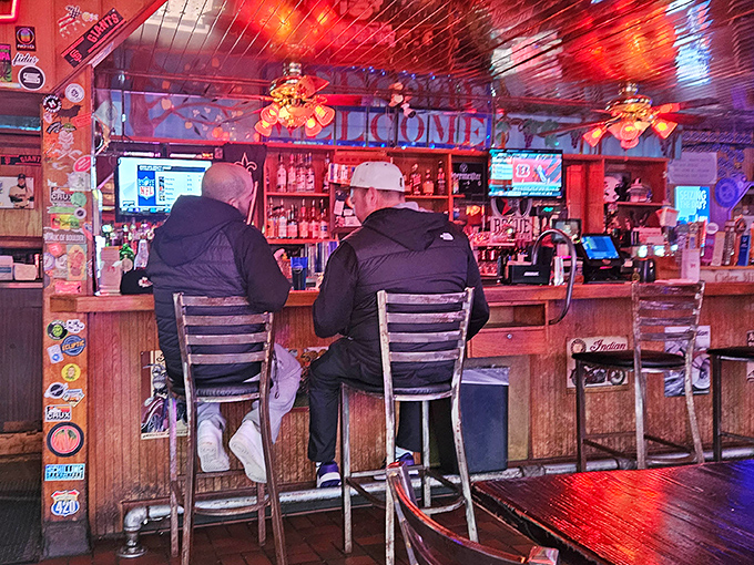 Bar seats filled with locals who know the best spot in Portland isn't the one with fancy cocktails, but with honest pours and familiar faces.