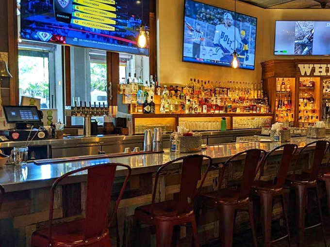 The bar area showcases an impressive spirits collection that proves Sauced takes the "Spirits" part of their name just as seriously as the "BBQ."