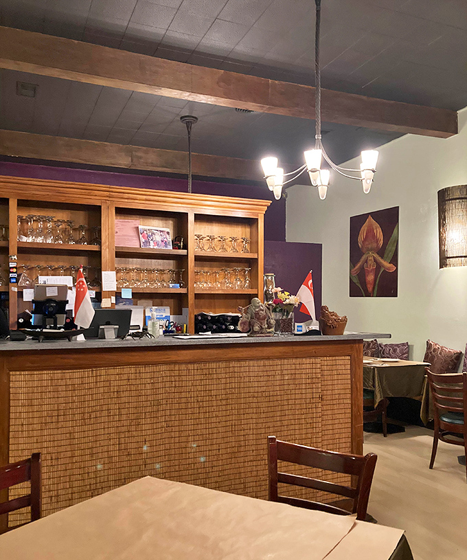 Warm wood tones, bamboo pillars, and golden tablecloths create an oasis of calm. Until the food arrives, that is, and calm gives way to culinary euphoria.