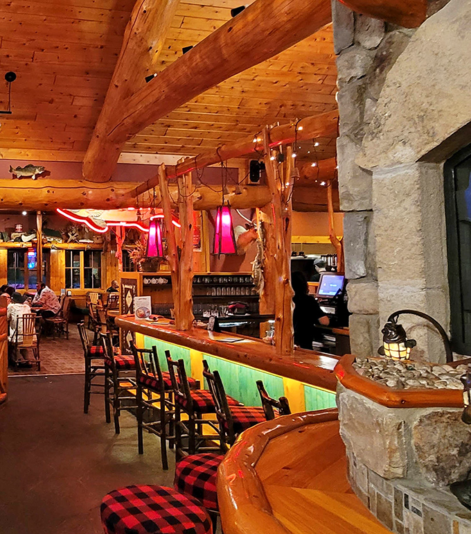 Another angle reveals the lodge's commitment to "rustic chic" &ndash; plaid cushions and all.