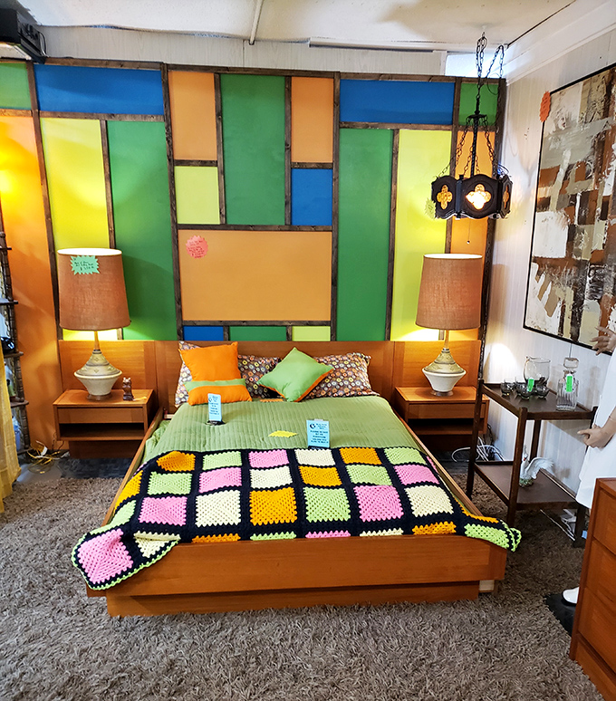 A bedroom display that's pure 1970s optimism&mdash;stained glass colors and a crocheted blanket that grandma would approve.
