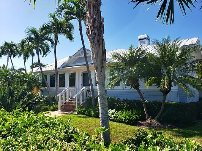 Classic Florida architecture with tropical landscaping creates the quintessential island aesthetic. This charming home embodies Boca Grande's relaxed sophistication.