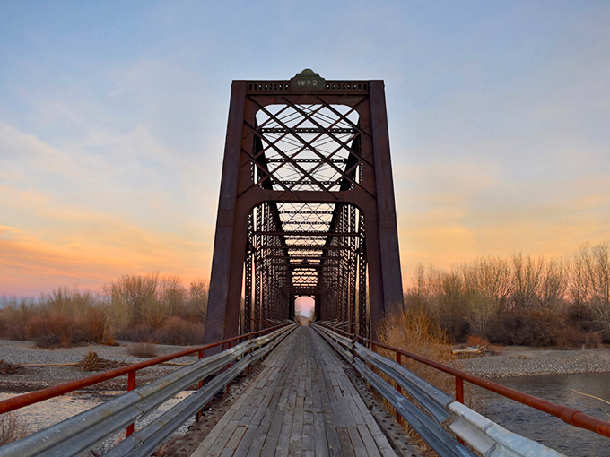 This historic bridge doesn't just span water&mdash;it connects present-day travelers to Wyoming's past, framing sunsets in weathered steel and timber.