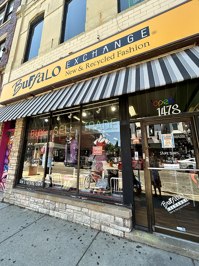 The storefront glows with possibility, that classic black-and-white awning promising style without the accompanying financial guilt trip.