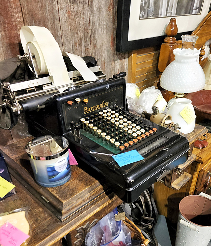 The Burroughs adding machine sits ready for action, a mechanical marvel from when "computing" meant physical keys and satisfying clicks.