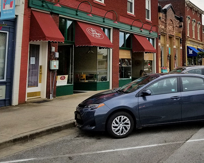 Midway's storefronts sport awnings in a rainbow of colors, each one marking a different small business adventure. The kind of Main Street that big box stores tried to eliminate.