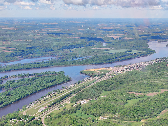 The mighty Mississippi curves through the landscape like nature's signature. From these heights, you can practically see tomorrow.