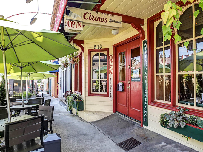 Cirino's red door swings open to culinary adventures, where umbrella-shaded tables invite you to linger over legendary Bloody Marys and local gossip.