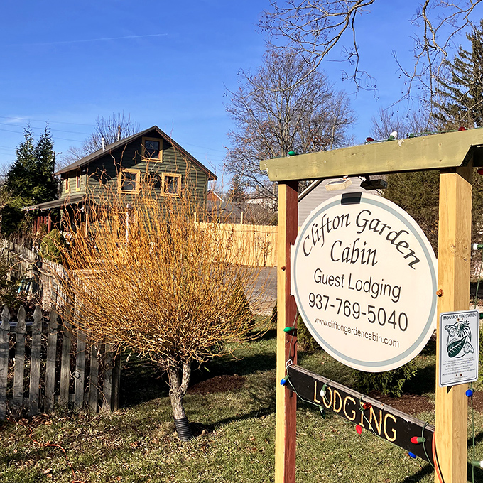 The Clifton Garden Cabin sign promises more than just a place to sleep&mdash;it's an invitation to wake up in a storybook setting.