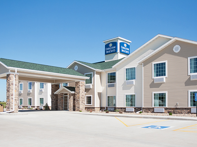 The Cobblestone Inn provides modern comfort with prairie-inspired design elements, a welcome respite after a day of covered bridge hunting and pie sampling.